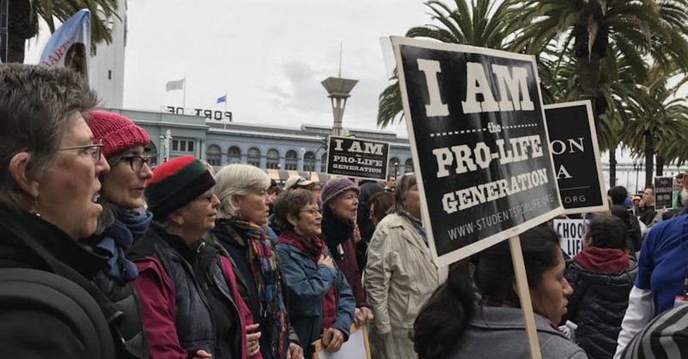 A pro-life and a pro-choice protest collided. There was singing and ...