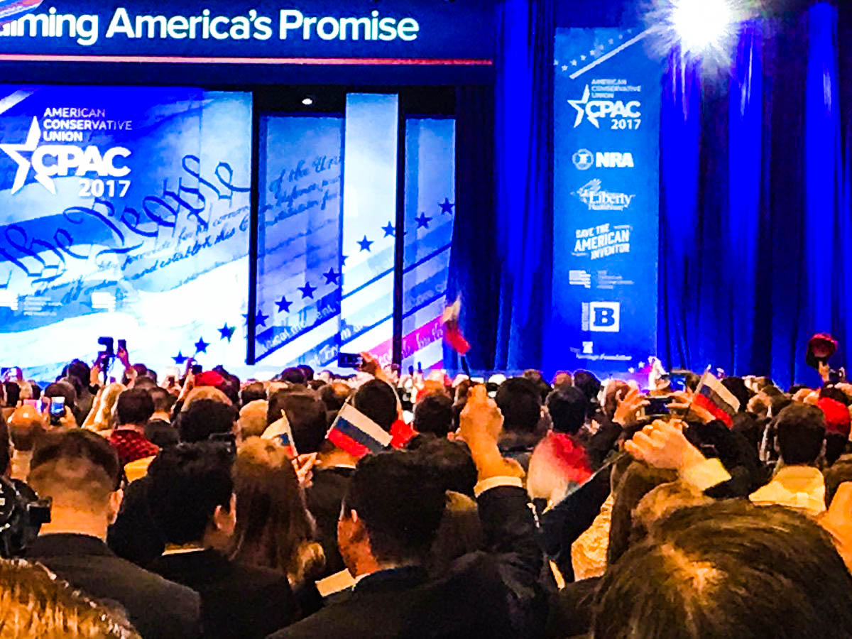 CPAC scrambles to control damage after attendees wave Russian flags ...